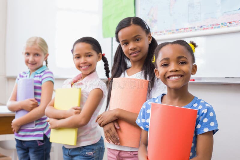 Cute Pupils Smiling at Camera during Class Presentation Stock Photo ...