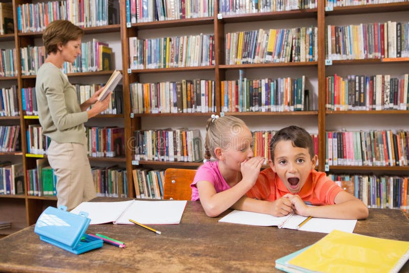 Cute Pupils Speaking at Library Stock Image - Image of caucasian, girl ...