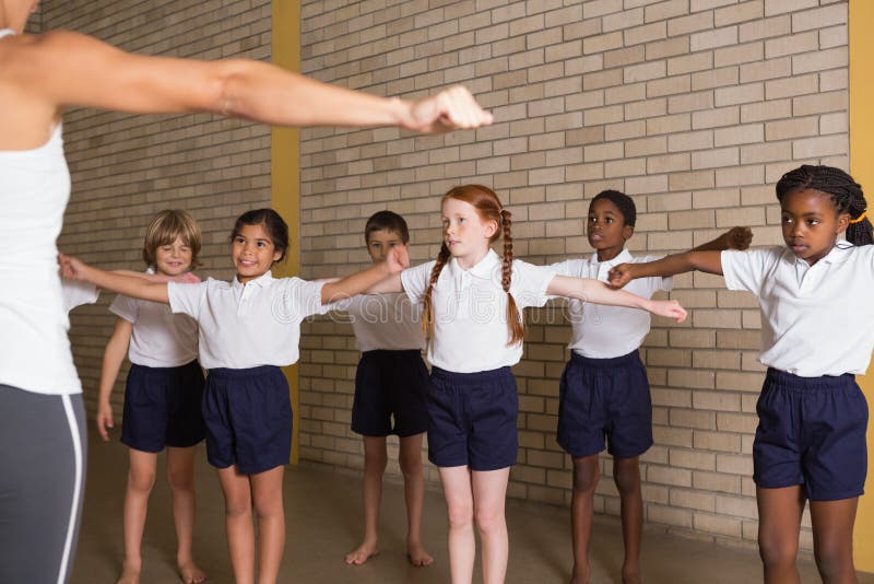 Cute Pupils Warming Up in PE Uniform Stock Image - Image of classmates ...