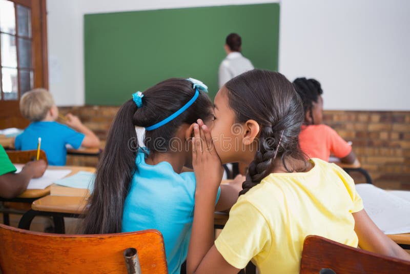 Pupils Whispering Secrets during Class Stock Image - Image of four ...
