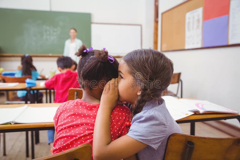 Child whispering at school stock photo. Image of gossiping - 6181822
