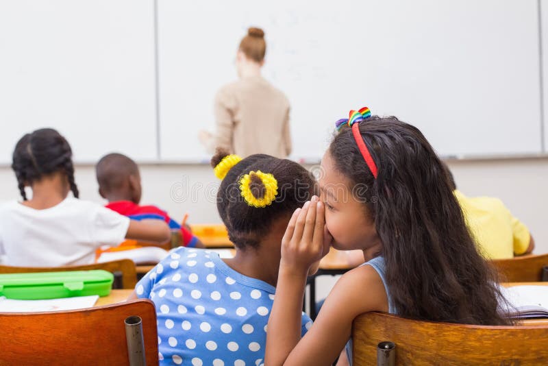 Cute Pupils Whispering in Classroom Stock Image - Image of indoors ...