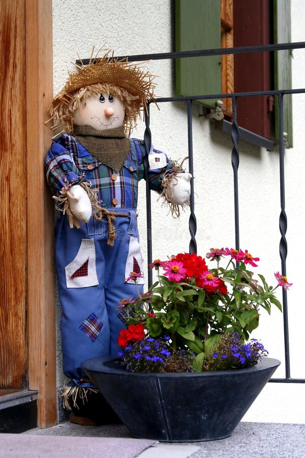 Cute Scarecrow Outside A House Stock Photo - Image of pretend, farm ...