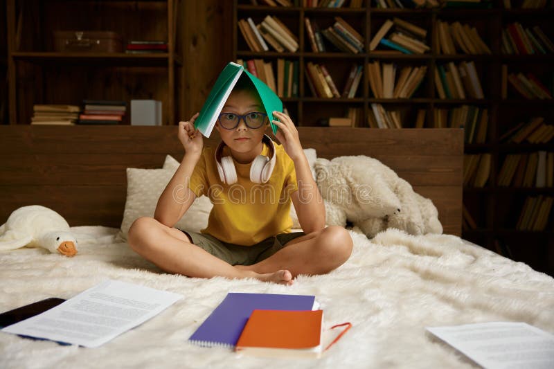 Cute School Boy Having Difficulties with Homework Sitting in Bed Stock ...