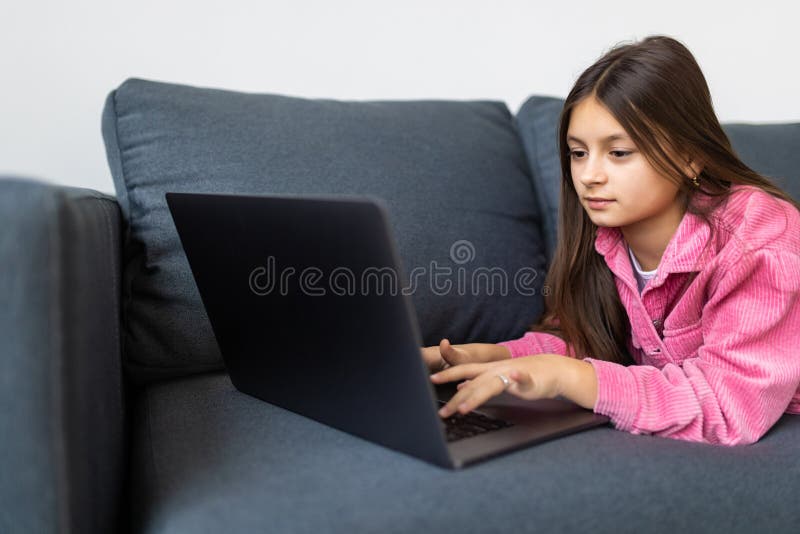 Cute School Girl Sitting on Sofa with Laptop Stock Image - Image of ...