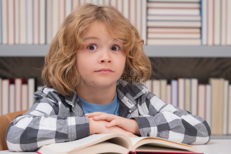 Child Reading a Red Book in the Library. Little Student on School ...