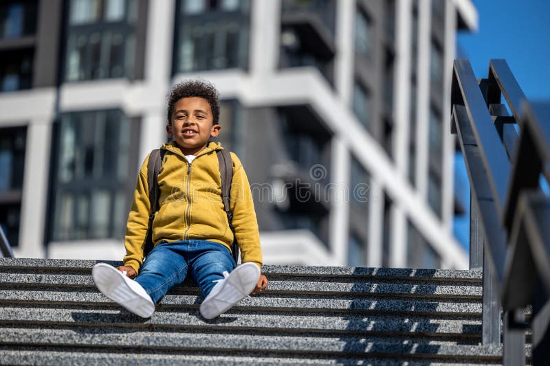 Cute Schoolboy Sitting on the Steps and Resting Stock Image - Image of ...
