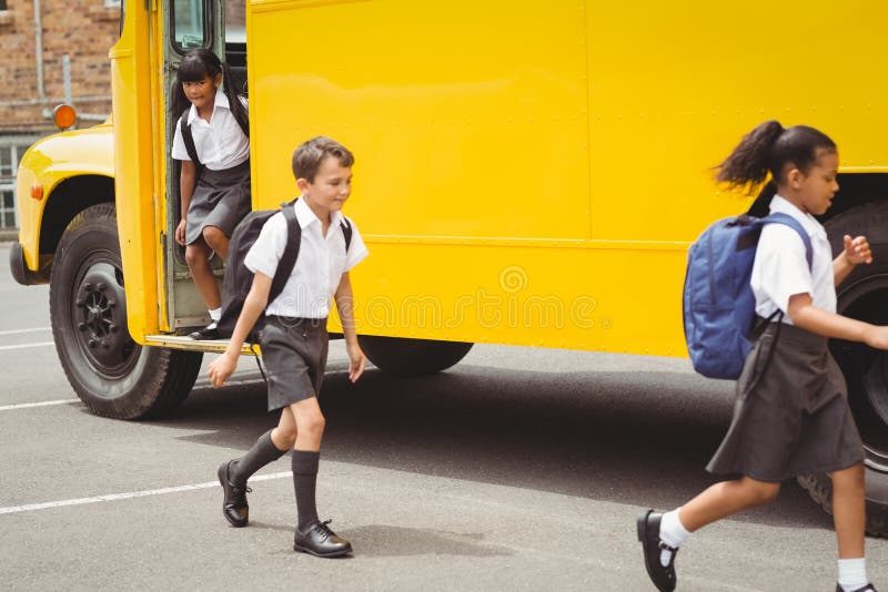 Cute Schoolchildren Getting Off the School Bus Stock Image - Image of ...