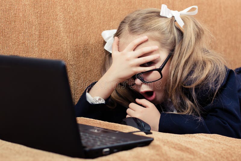 Child with a Laptop in Shock. Stock Photo - Image of education ...