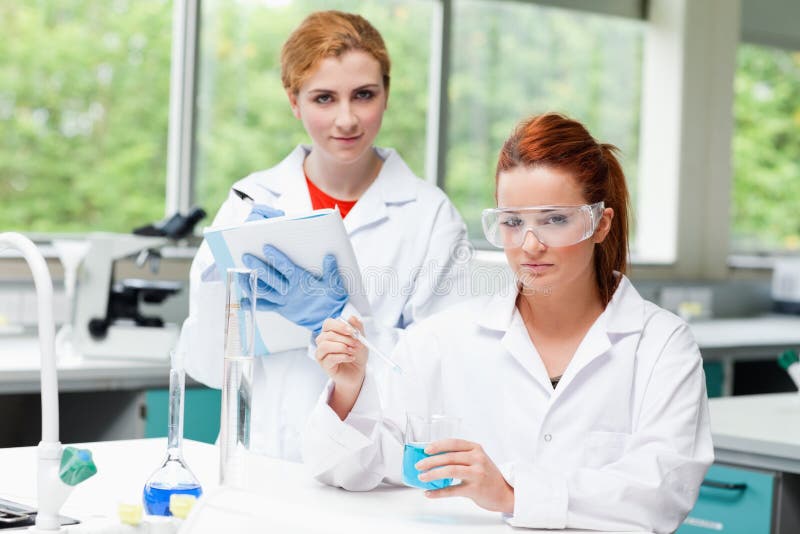 Cute Science Students Doing an Experiment Stock Photo - Image of ...