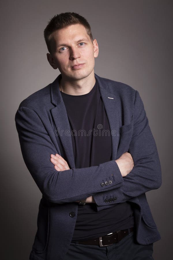 Cute Serious Young Man in a Jacket, Gray Background Stock Photo - Image ... Cute Serious Young Man in a Jacket, Gray Background Stock Photo - Image ...