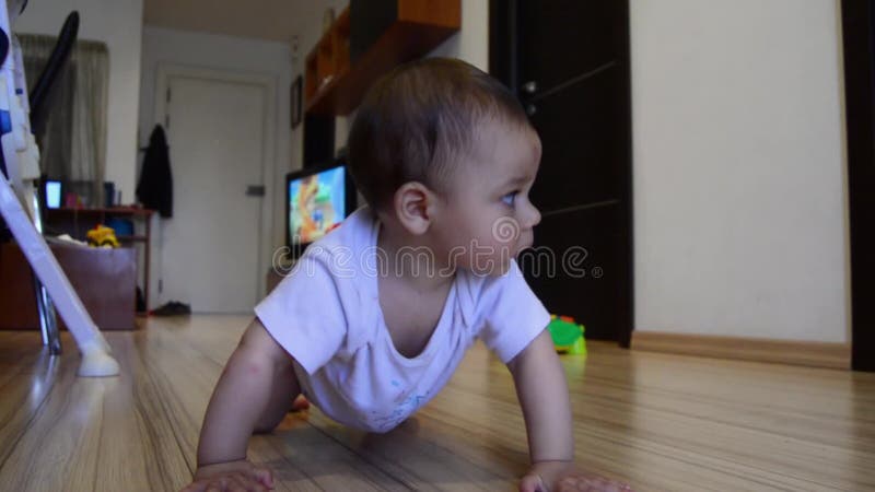 Cute Seven Months Old Baby Boy Learning Crawling,dolly Out Shot Stock ...