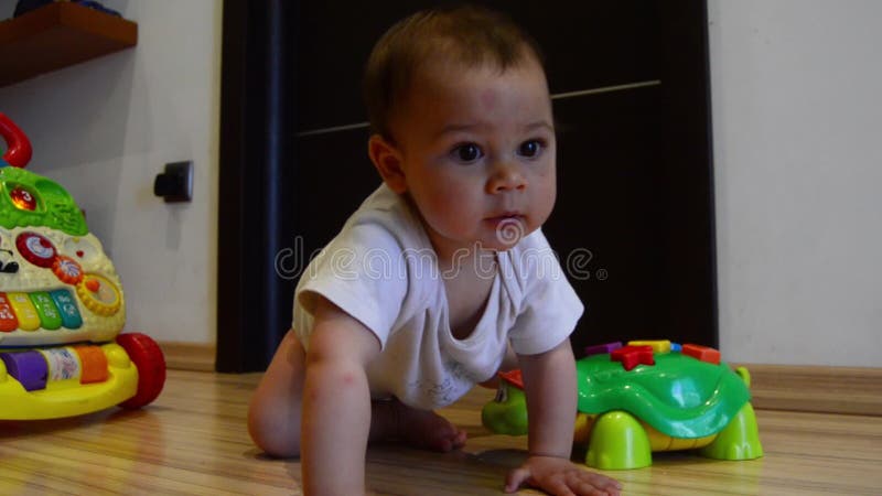 Cute Seven Months Old Baby Boy Learning Crawling, Static Shot Stock ...