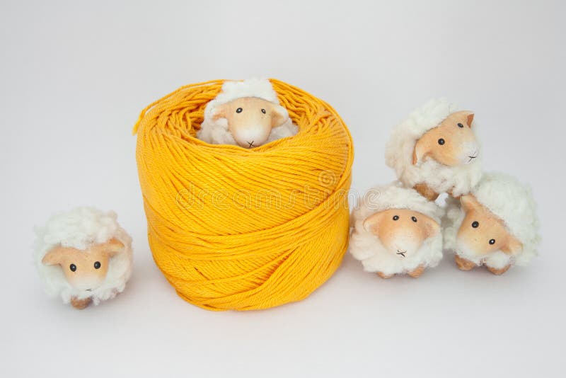 Cute Sheep Playing Together with a Ball of Yellow Wool Stock Image ...