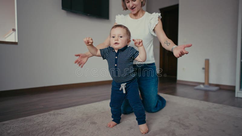 Cute Smiling Baby Boy Learning To Walk. Baby S First Steps. Baby Making ...