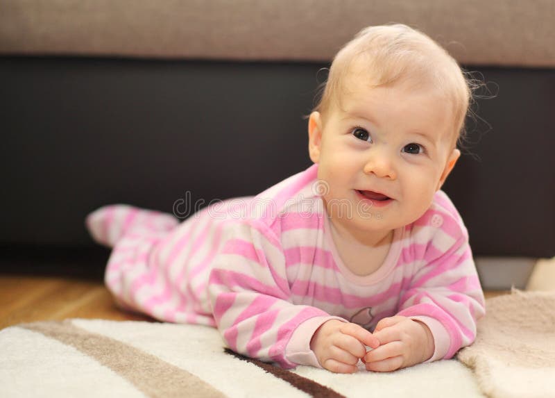 Cute Smiling Baby Lying on Floor Stock Photo - Image of beauty ...