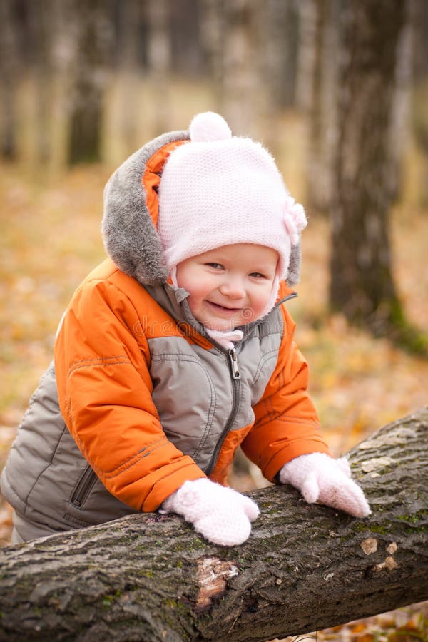 Cute Smiling Baby Stay Near Fallen Tree Stock Image - Image of grass ...