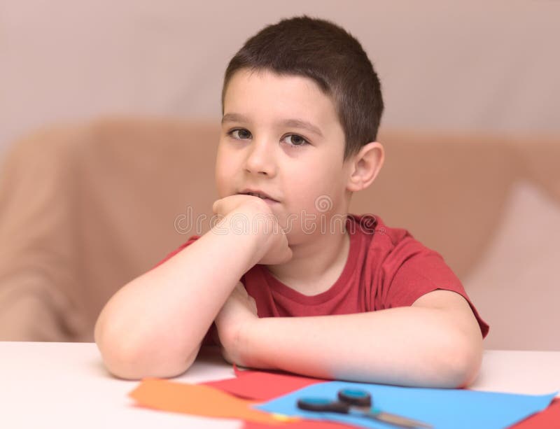 Cute Smiling Boy is Cutting Paper Using Scissors Stock Photo - Image of ...