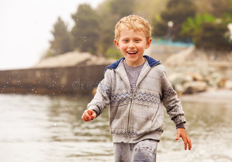 Cute Smiling Little Boy Run in Water Drops Stock Image - Image of ...
