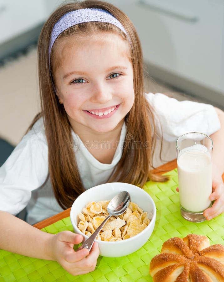 Little Girl Eating Her Breakfast Stock Image - Image of happiness ...