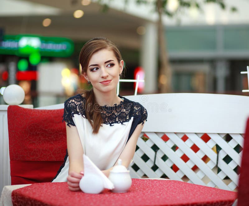 Cute Smiling Woman Sitting Inside in Restaurant Stock Image - Image of ...