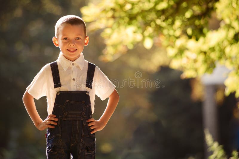 Cute Smiling Young Boy Backlit by the Sun Stock Image - Image of spring ...
