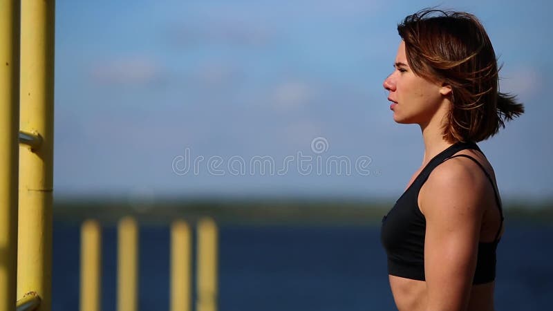 Cute Sporty Brunette With Blue Leggings Perform Exercises To Strengthen