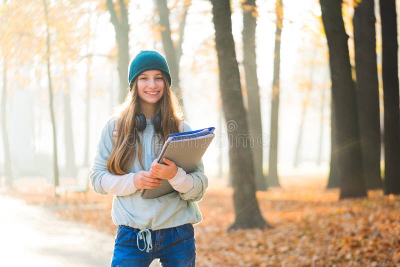 Cute Student in Autumn Park Stock Photo - Image of foggy, haze: 216706550