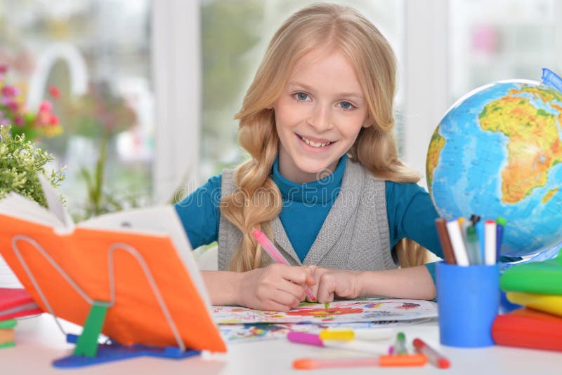 Cute student girl at class stock photo. Image of book - 73579860