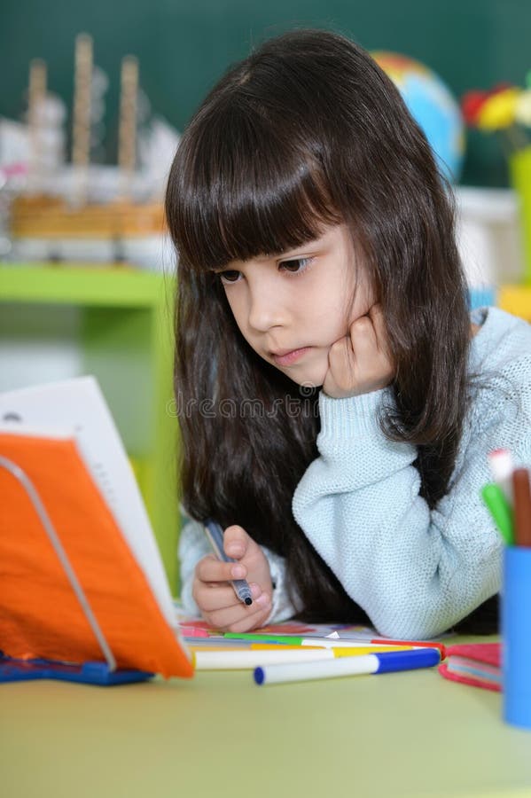 Cute student girl at class stock photo. Image of exam - 73917108