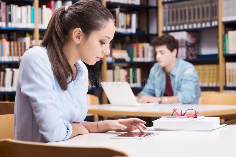 Cute student with glasses stock photo. Image of library - 53122908
