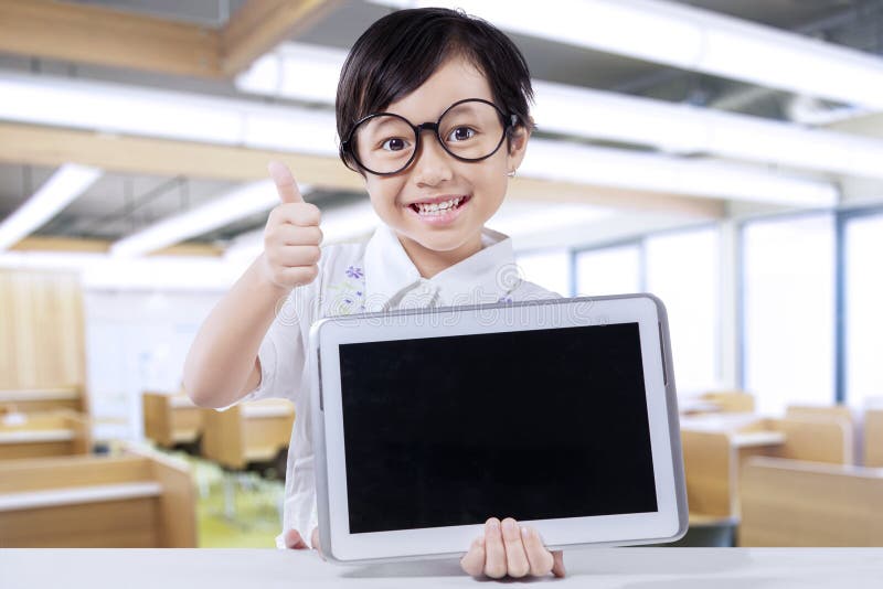 Cute Student Shows Tablet and Thumb Up Stock Photo - Image of child ...