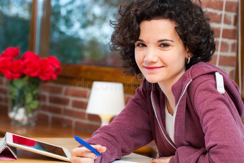 Cute Student Sitting at Table with Homework. Stock Image - Image of ...