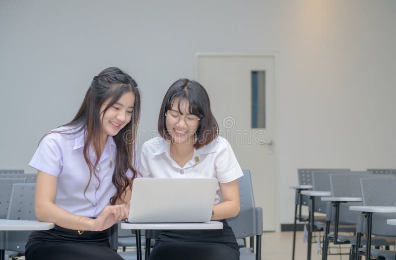 Teenage Students in Uniform Working with Laptop in Classroom Stock ...