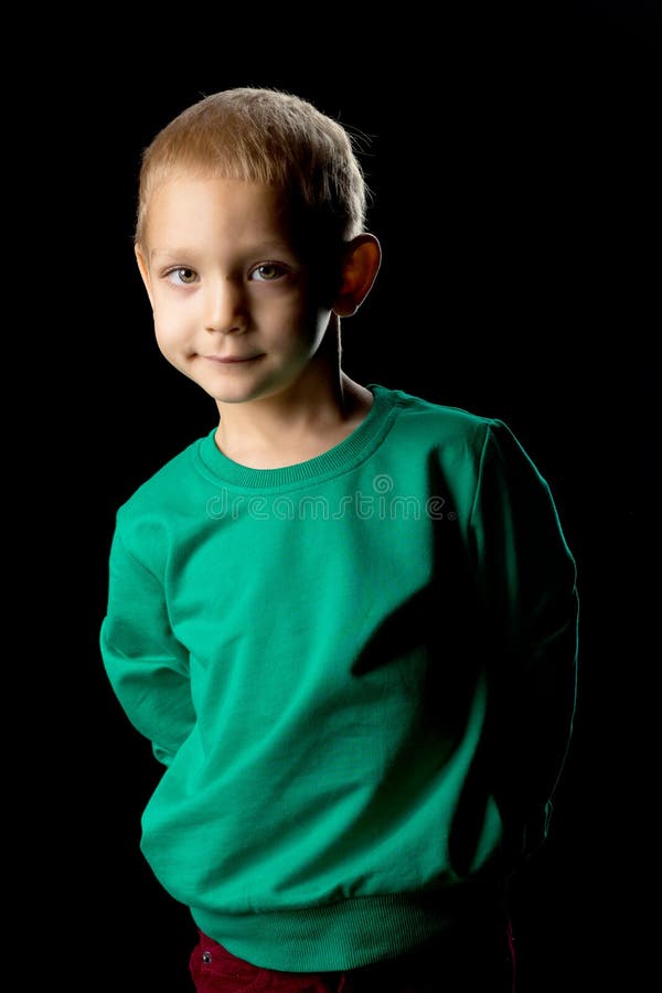 Cute Stylish Boy Posing Posing and Looking Up in Studio Stock Photo ...