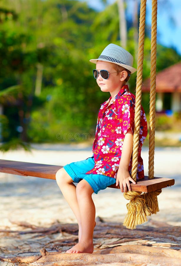 Cute Stylish Boy on Swings on the Beach Stock Image - Image of relax ...