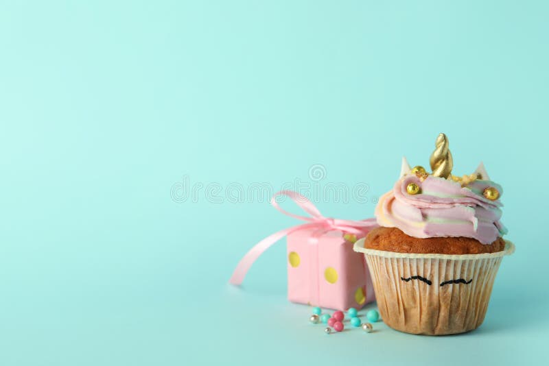 Cute Sweet Unicorn Cupcake and Gift Box on Light Turquoise Background ...