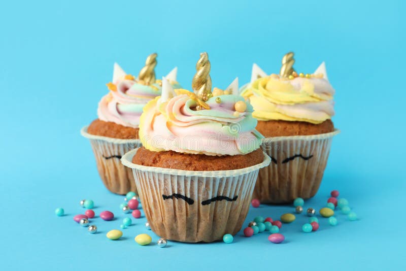 Cute Sweet Unicorn Cupcakes on Light Blue Background Stock Photo ...
