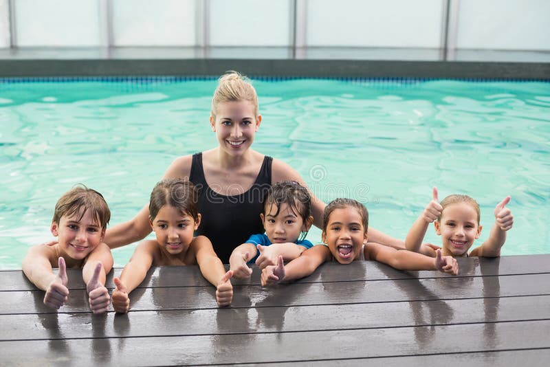 Cute Swimming Class in Pool with Coach Stock Image - Image of child ...