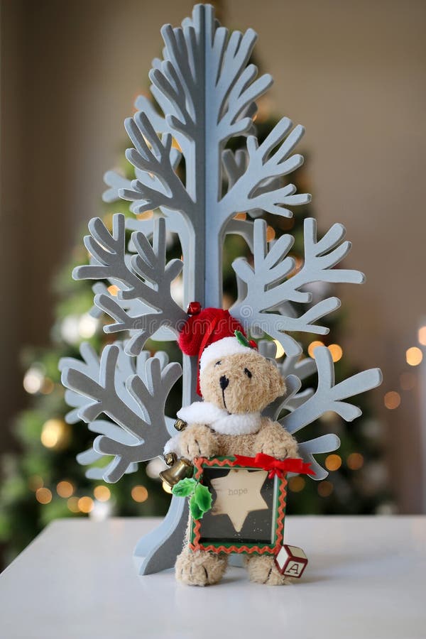 Teddy Bear Under the Christmas Tree Holding Onto Hope Stock Image ...