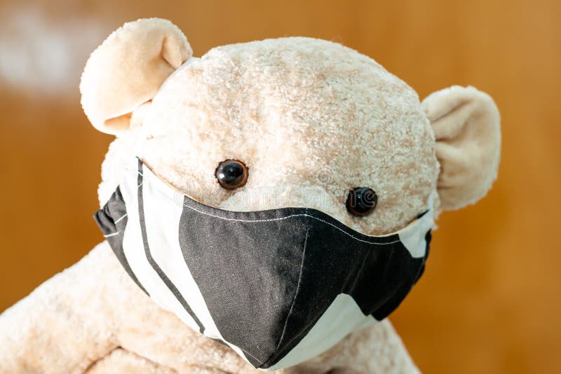 Cute Teddy Bear Wearing a Mask - Focus on the Mask Stock Photo - Image ...