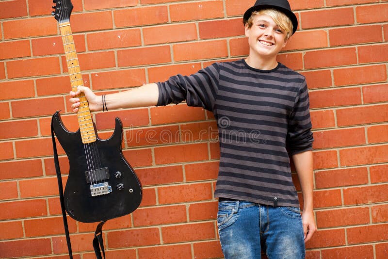 Cute teen musician stock photo. Image of playing, brick - 24782410
