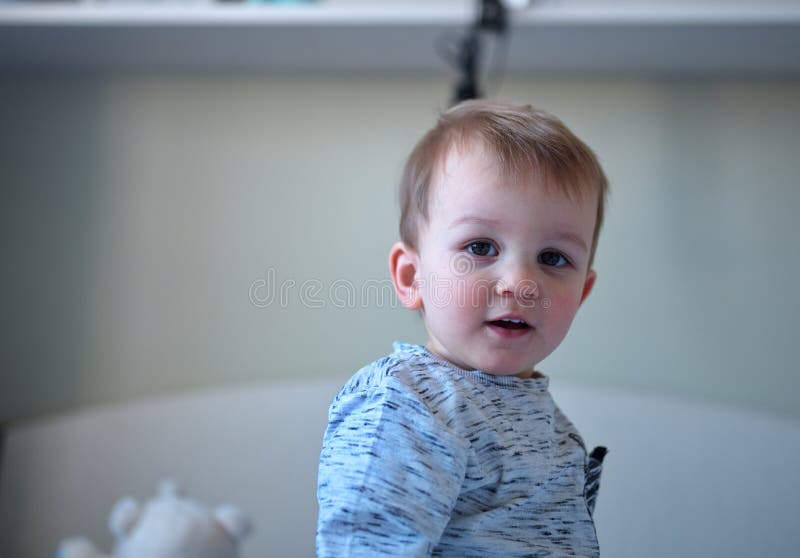Cute toddler on the bed stock image. Image of human - 258235535