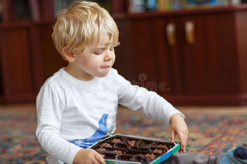 Cute Toddler Boy of Two Years Eating Chocolate Stock Image - Image of ...
