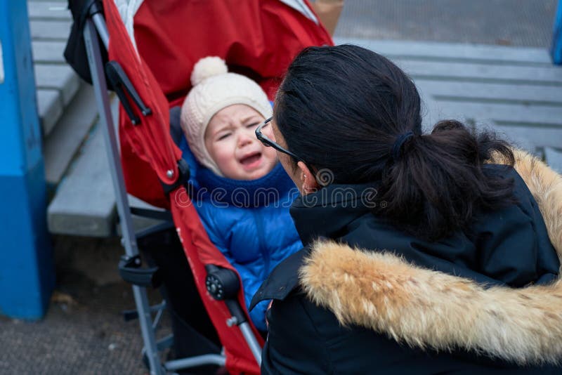 Cute Toddler Crying in the Stroller on the Playground Stock Photo ...