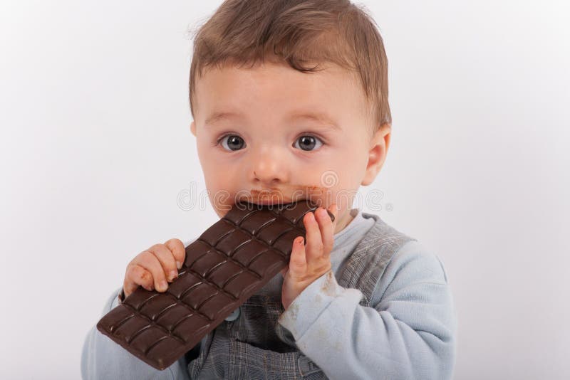 Cute Toddler Eating Chocolate Stock Photo - Image of white, toddler ...