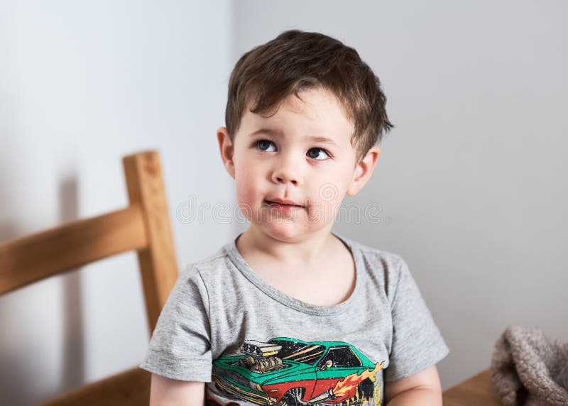 Young Boy Making Faces at the Kitchen Table Stock Photo - Image of ...