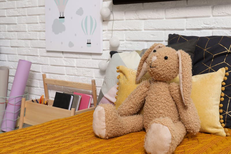 Cute Toy Bunny on Bed with Blanket. Bedroom Interior Stock Photo ...