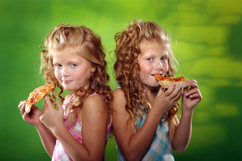 Cute Twin Girls Eating Pizza Stock Image - Image of happy, couple: 22676475