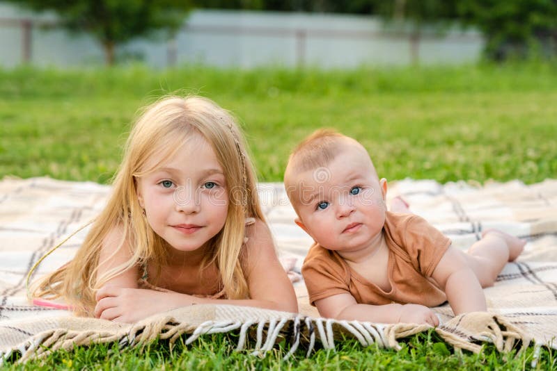 Cute Childrens Lying on a Blanket at Summer Stock Image - Image of ...